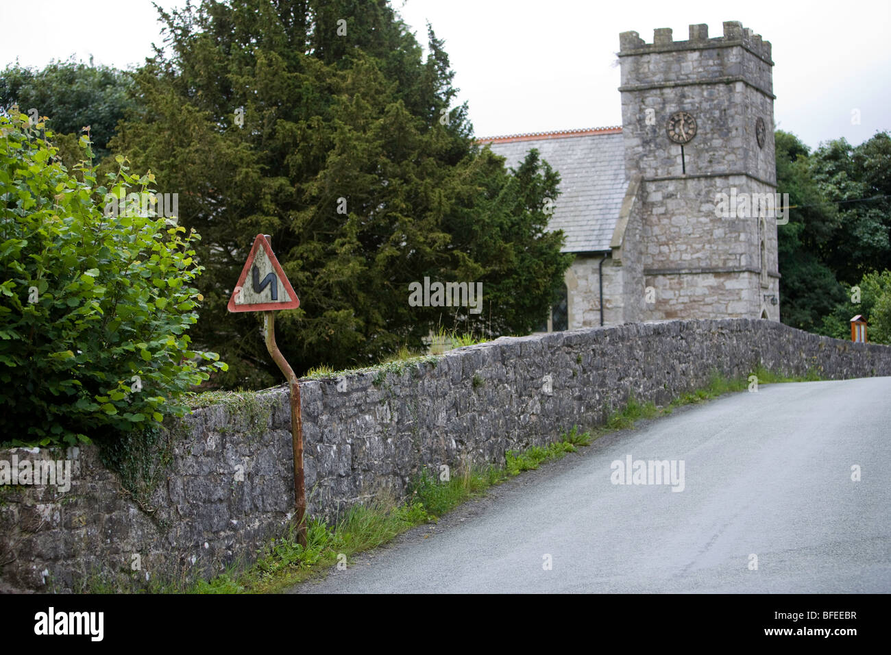 Church nead double bend first to the left road sign. Crooked sign on ...