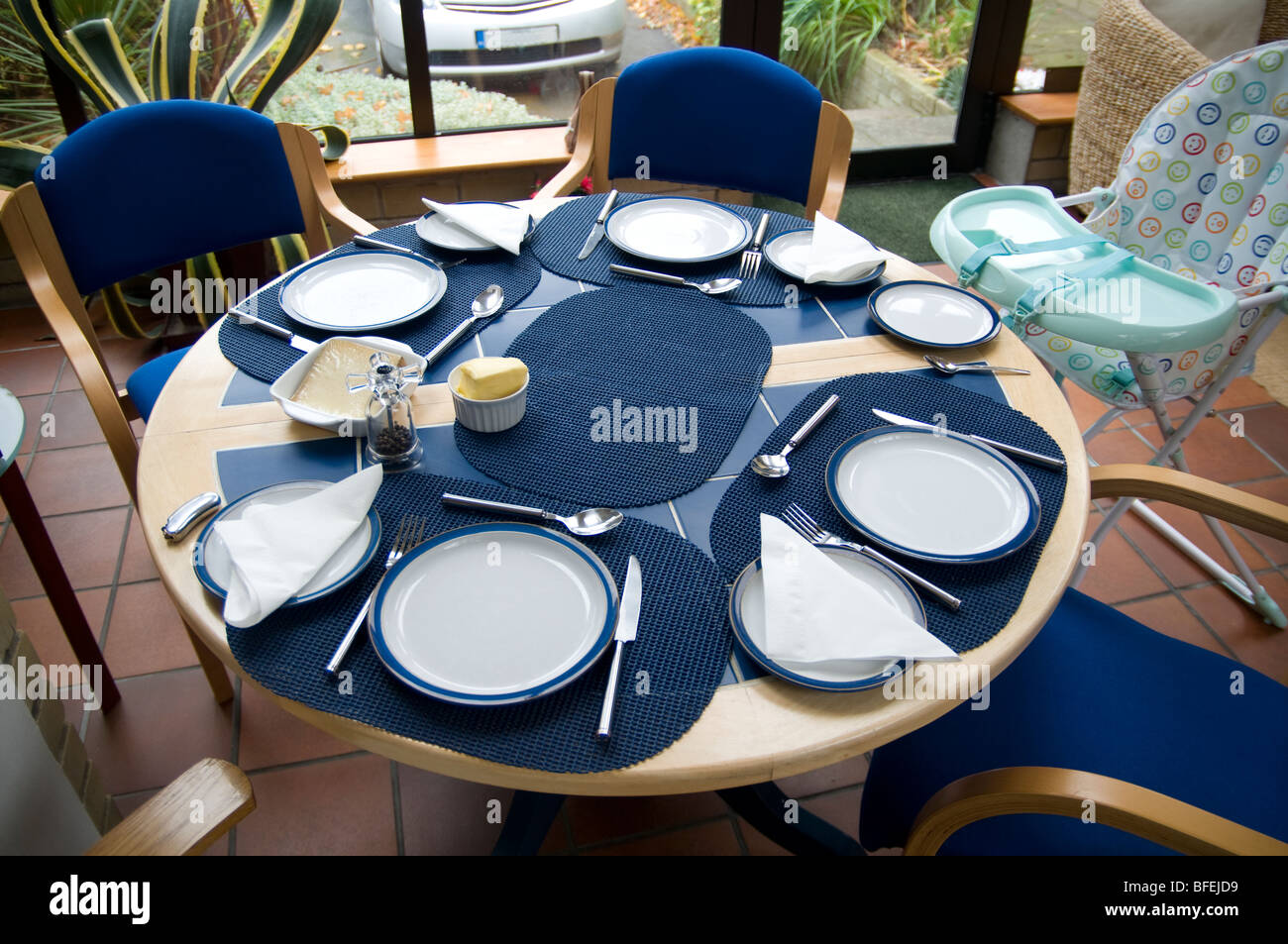 A table set for a family dinner Stock Photo - Alamy