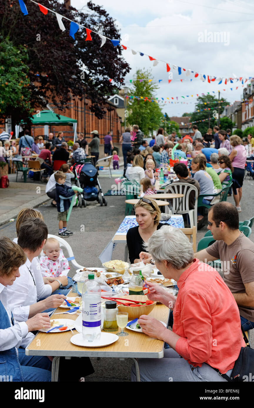 Communal dining in the street, St Margarets, London, as part of the ...