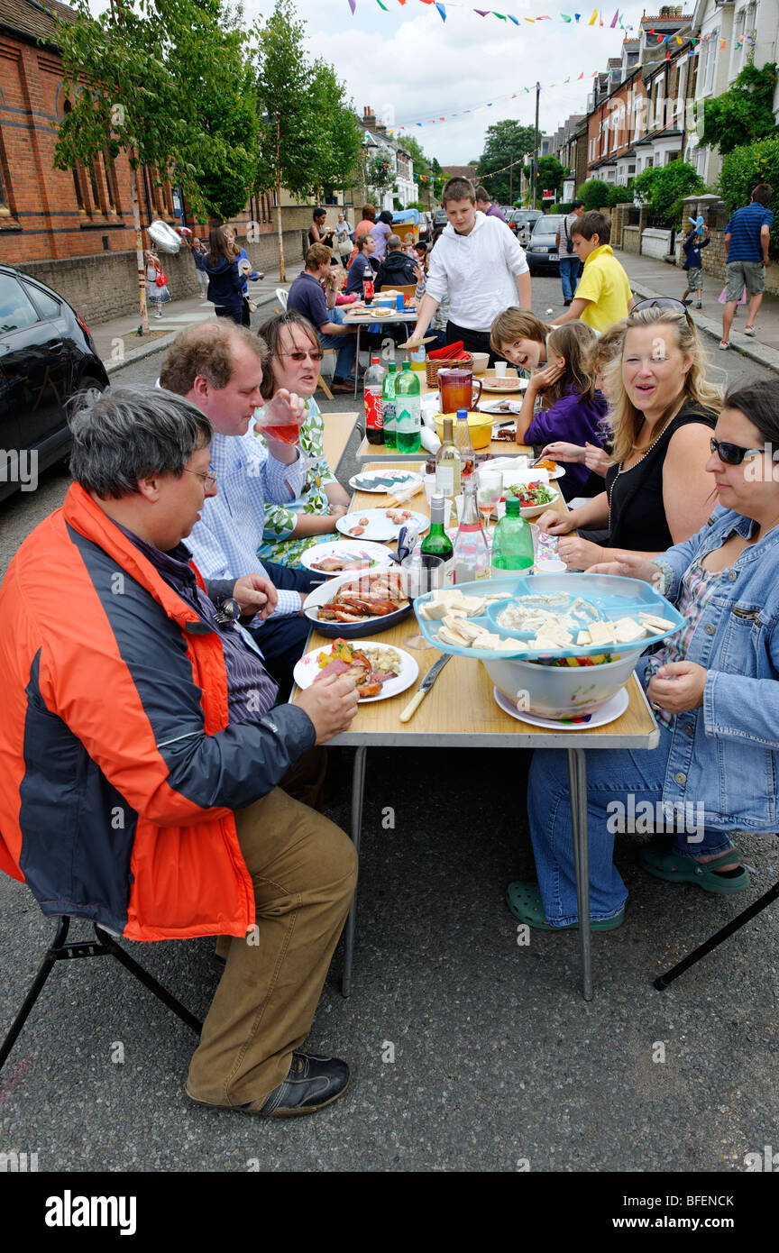 Communal dining in the street, St Margarets, London, as part of the ...