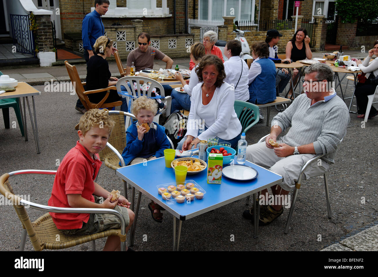 Communal dining in the street, St Margarets, London, as part of the ...
