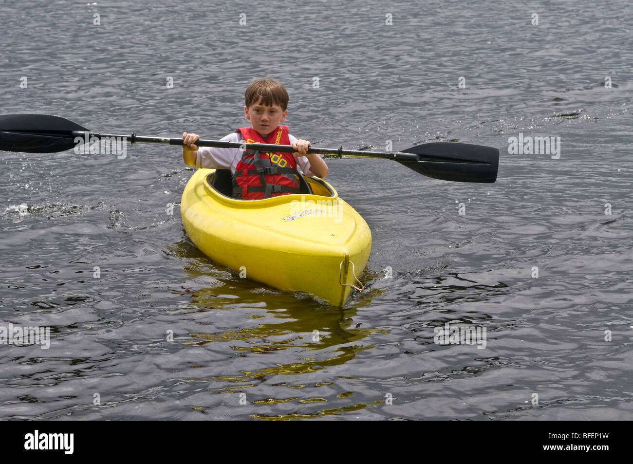 One colorful yellow kayak Stock Photo - Alamy