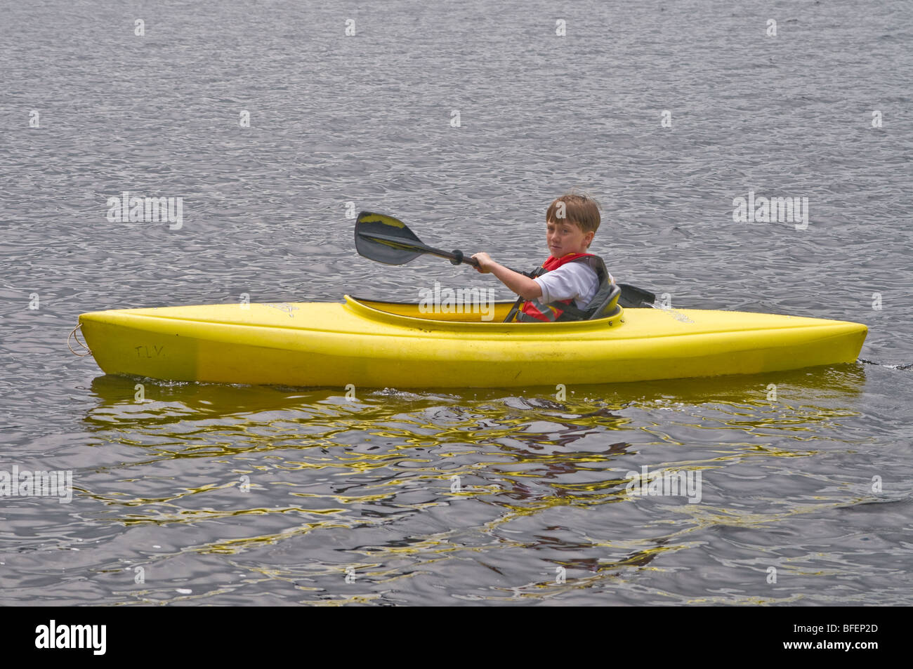 One colorful yellow kayak Stock Photo - Alamy
