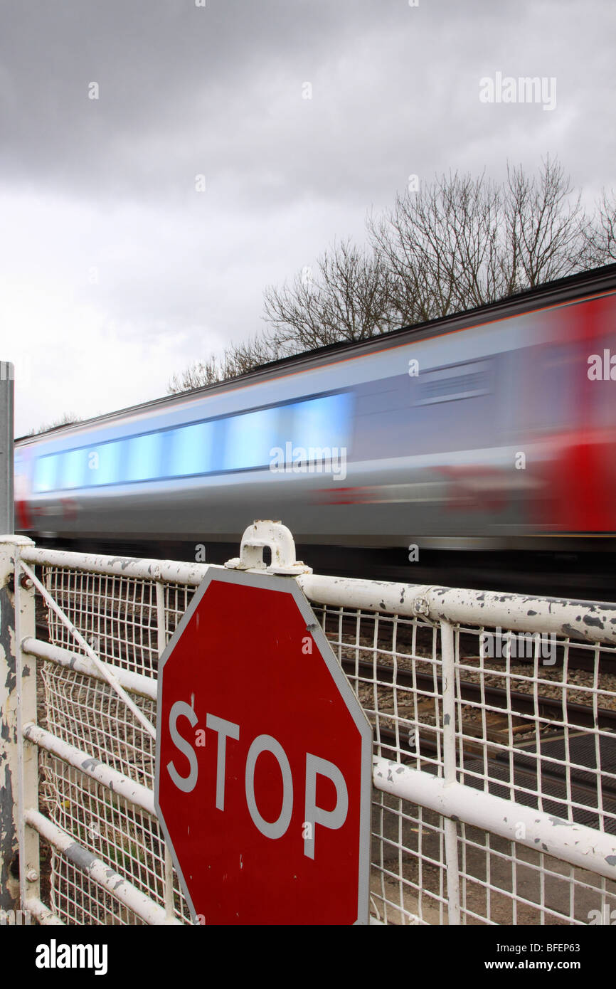 Train passing manned gated level crossing, Worcestershire, England UK ...