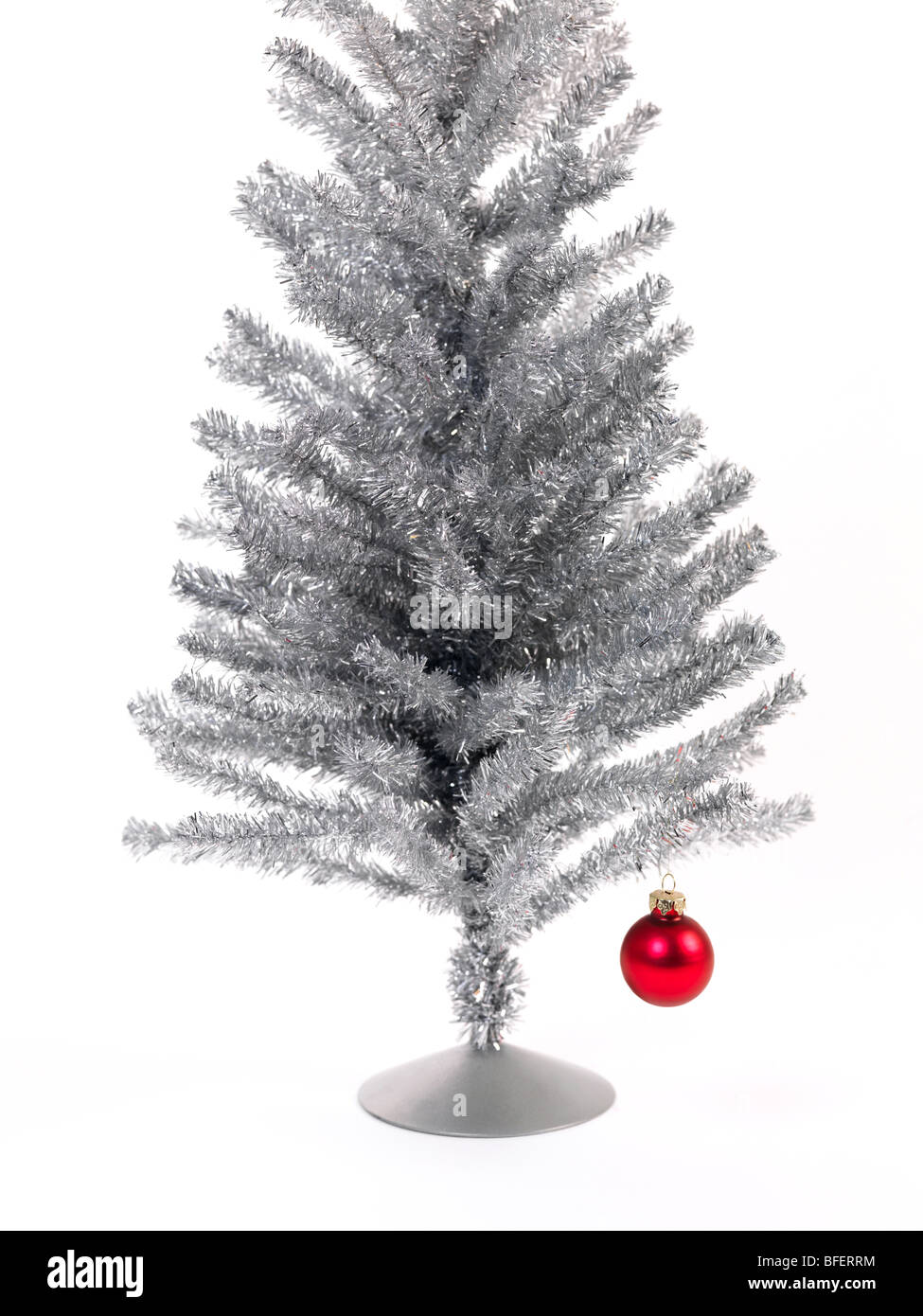 A silver Christmas tree and presents isolated against a white ...