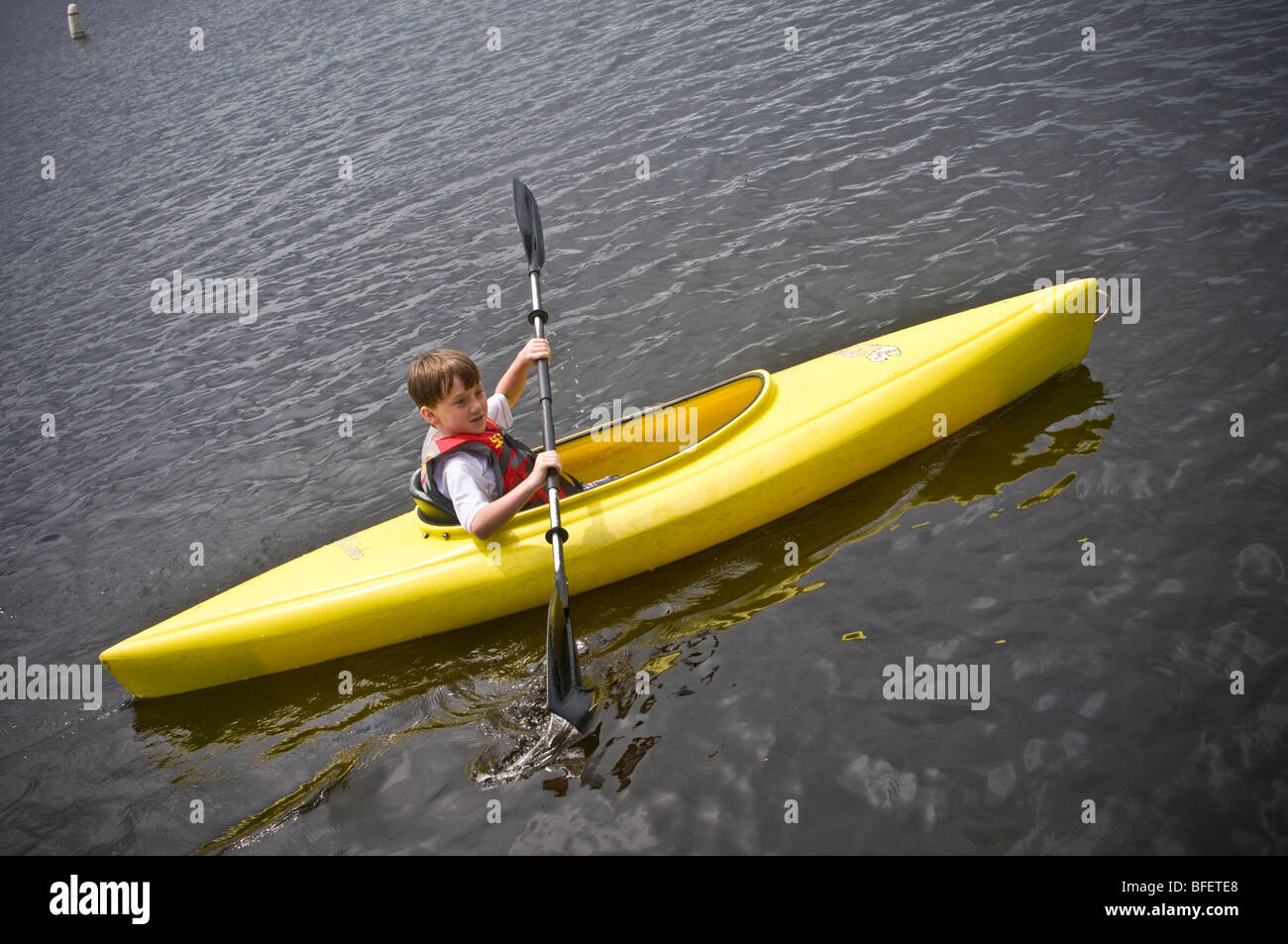 One colorful yellow kayak Stock Photo - Alamy