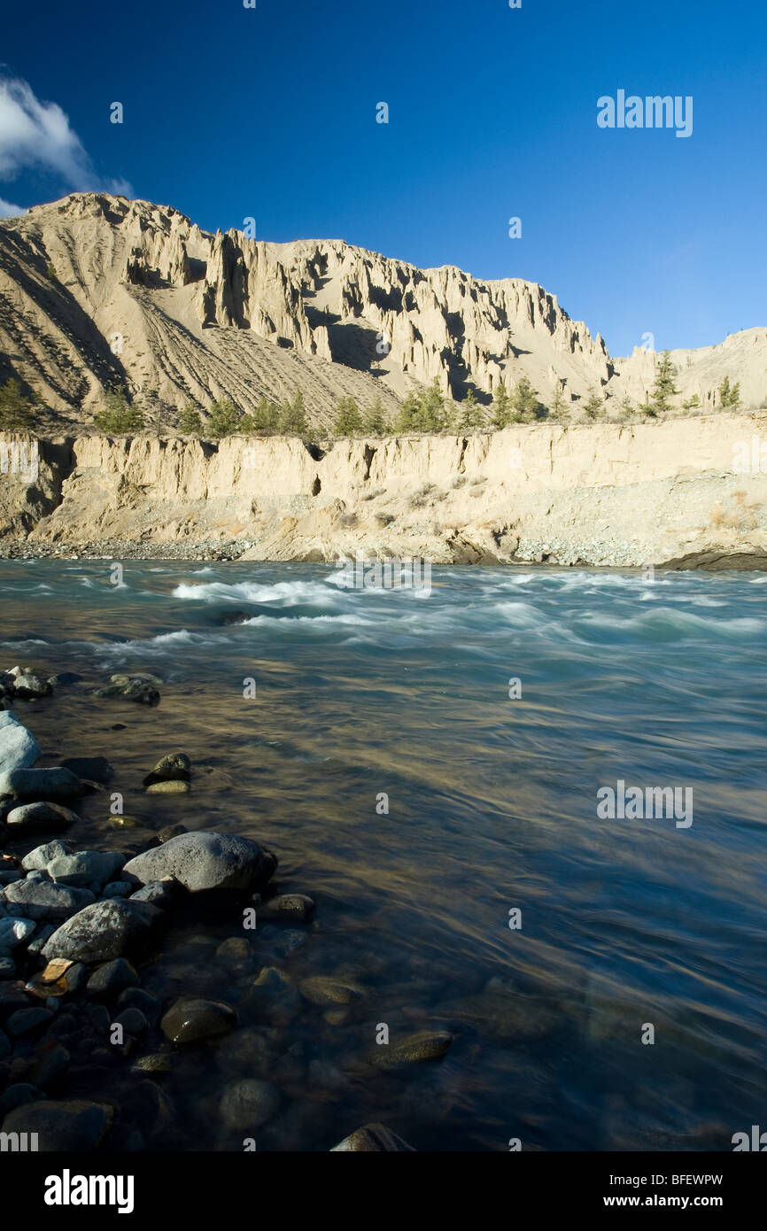 The Chilcotin River flows by sandstone cliffs as it nears the Fraser ...