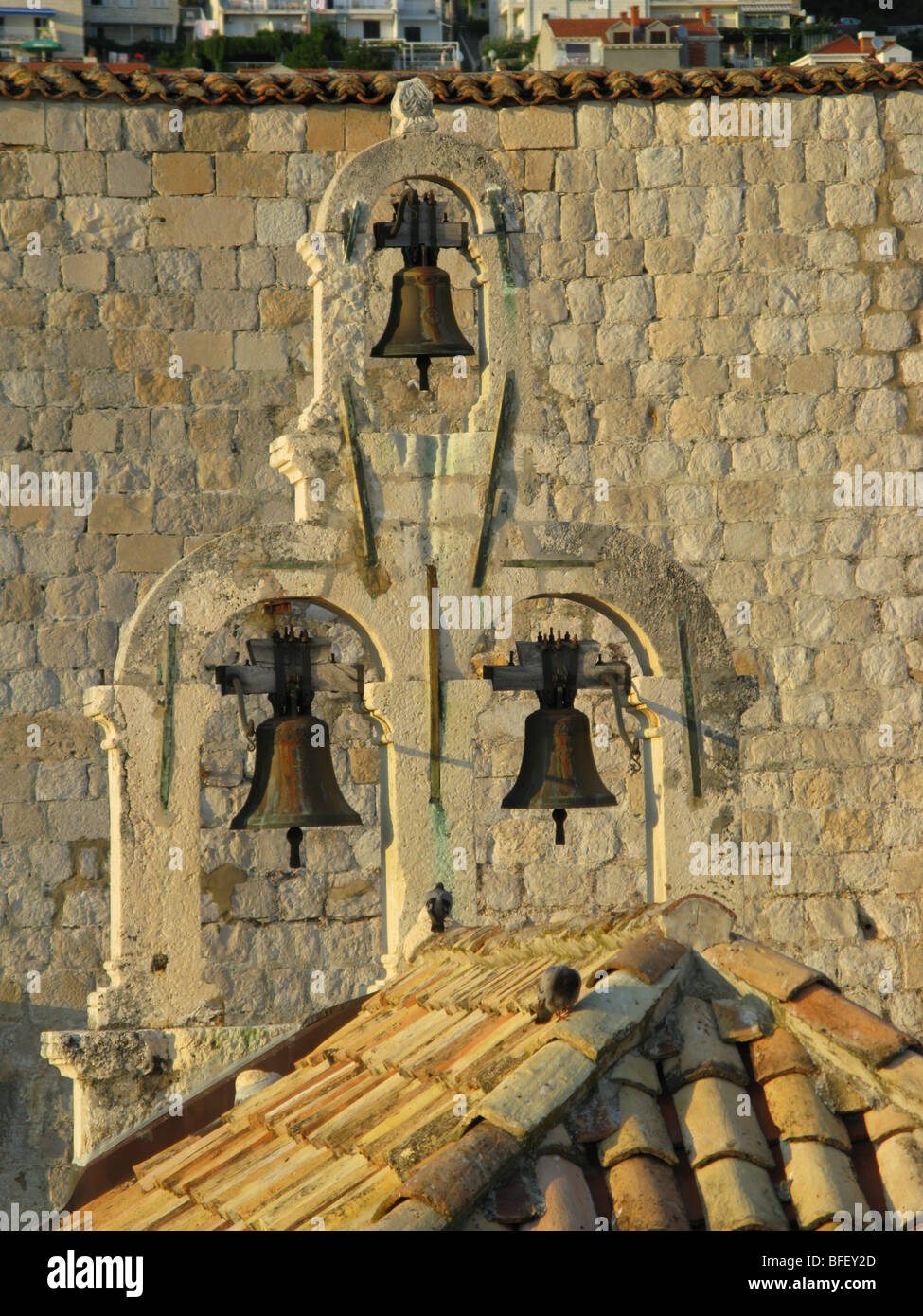 Bell tower with three bells on tiled roof of small chapel Dubrovnik Old ...
