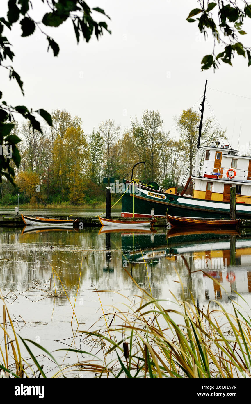 S.S. Master docked at Steveston, BC, with three row boats Stock Photo ...