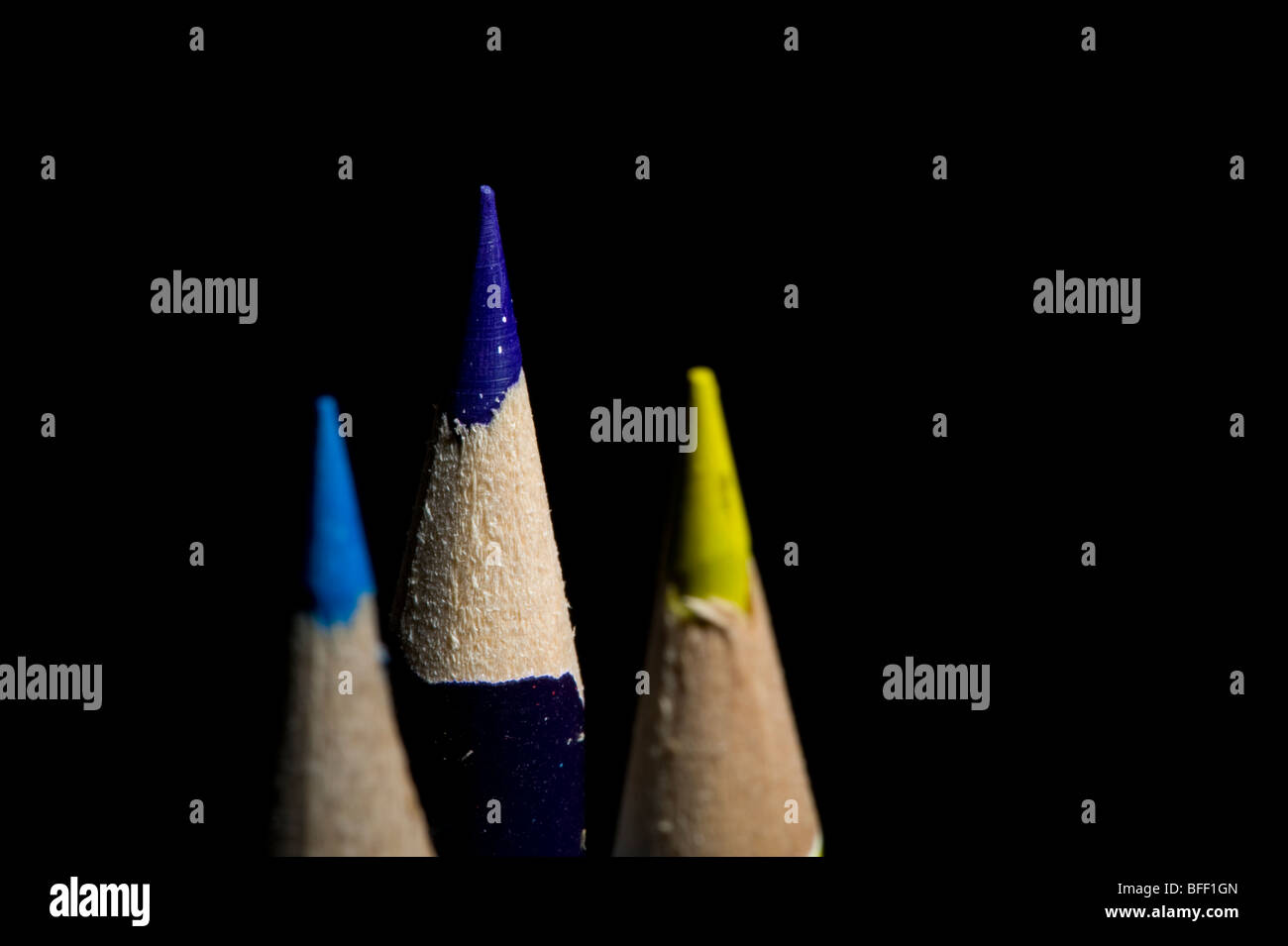 Three colored pencil points sharpened Stock Photo - Alamy