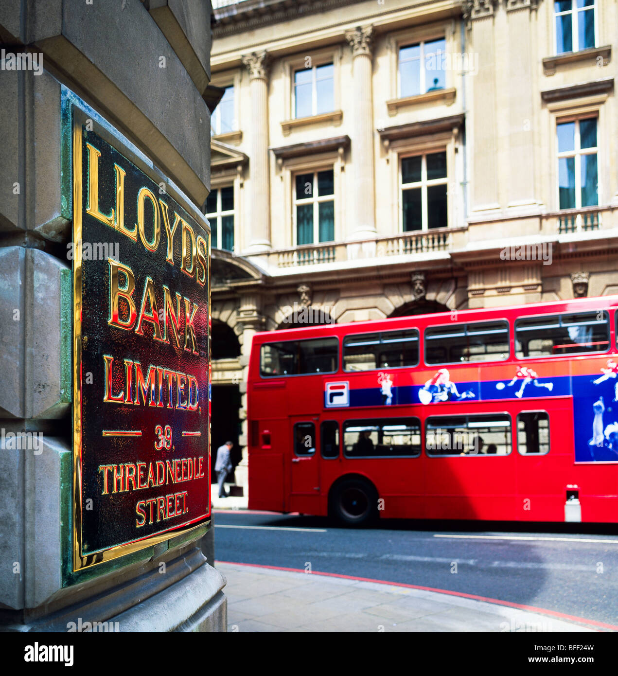 Lloyds bank brass sign and red double decker bus at Threadneedle street ...