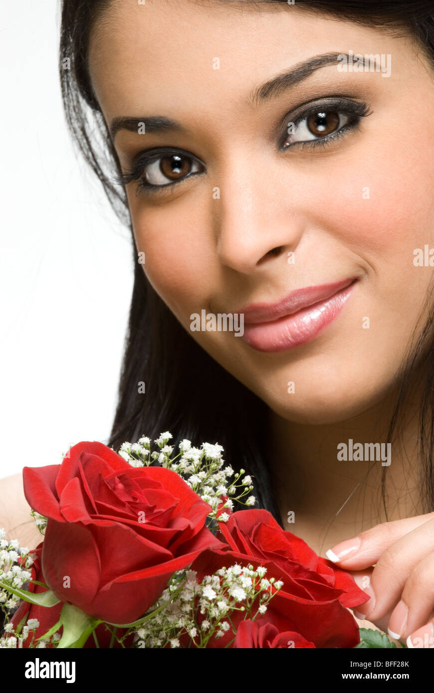 Beautiful, young Latina woman with roses Stock Photo - Alamy