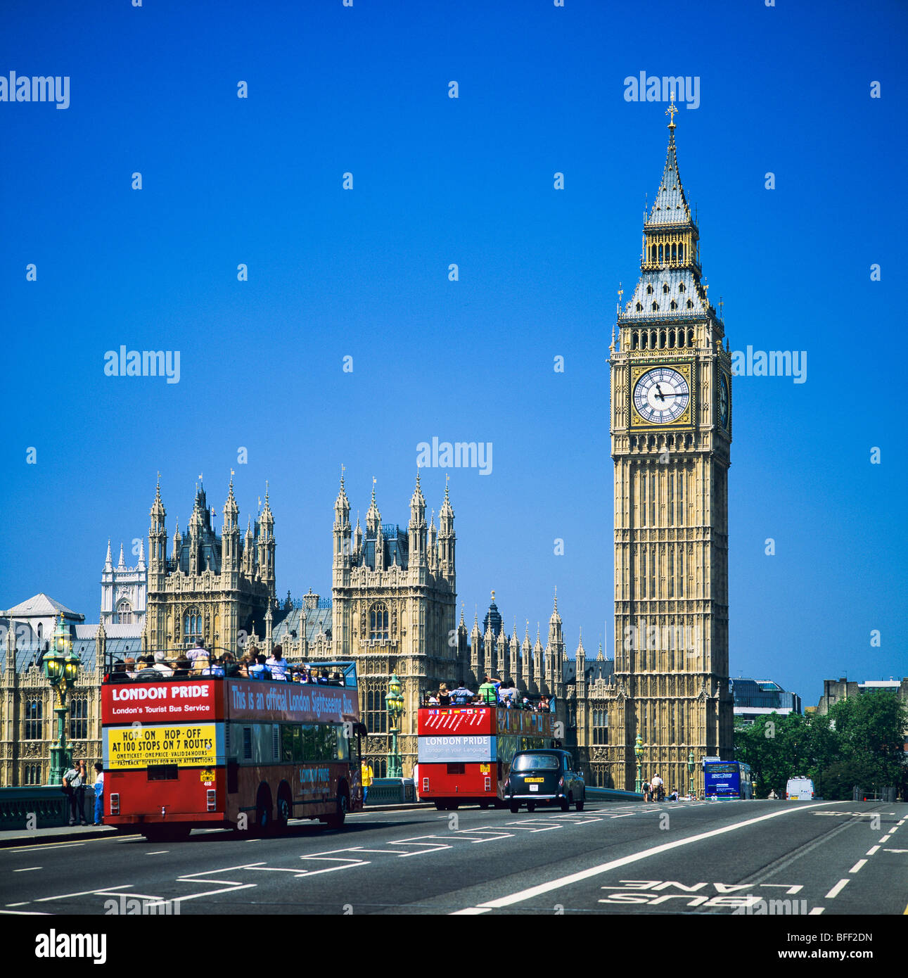 Red sightseeing double decker buses on Westminster bridge and ...