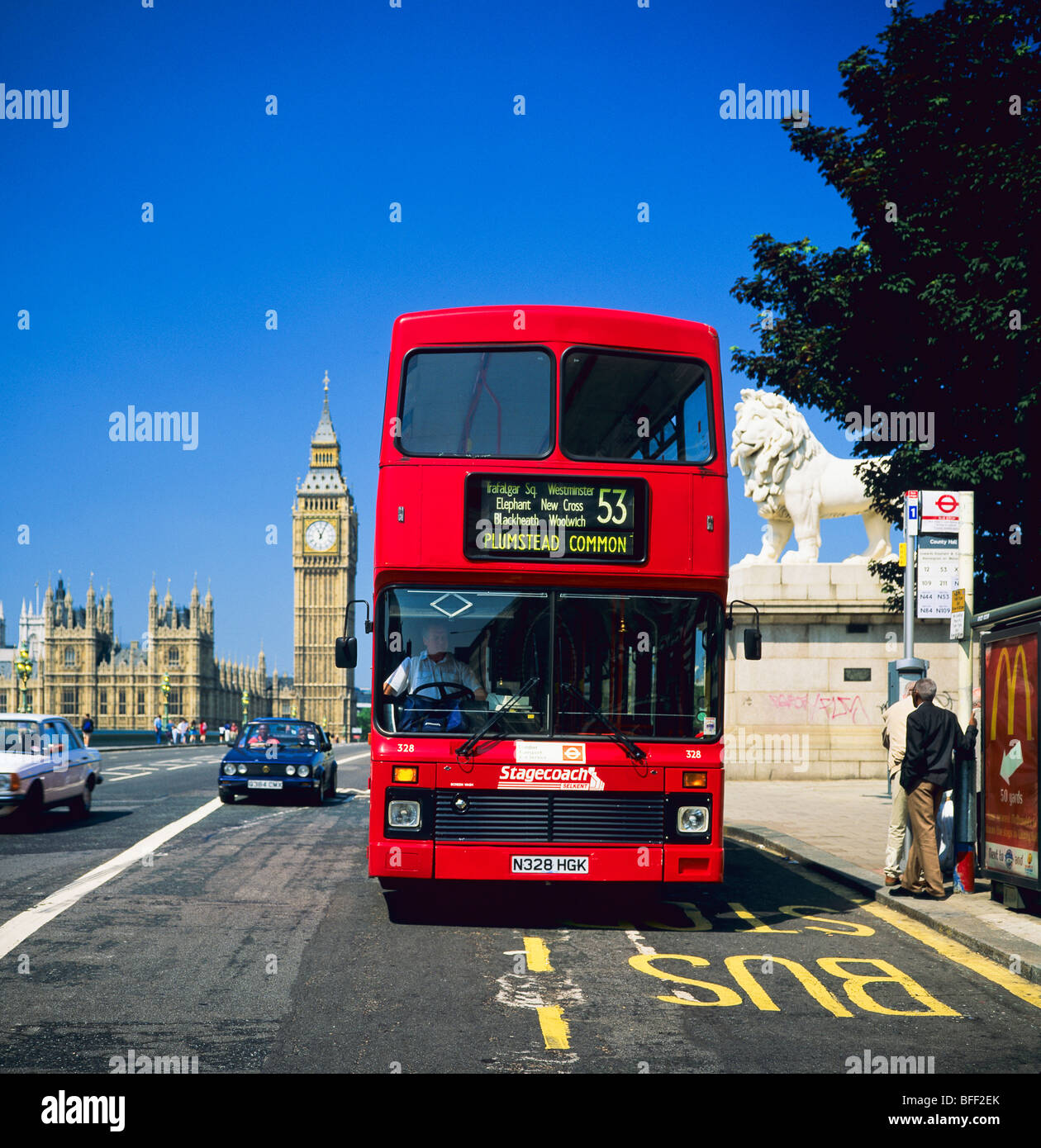 Red double decker bus at Westminster bridge stop and Westminster Palace ...