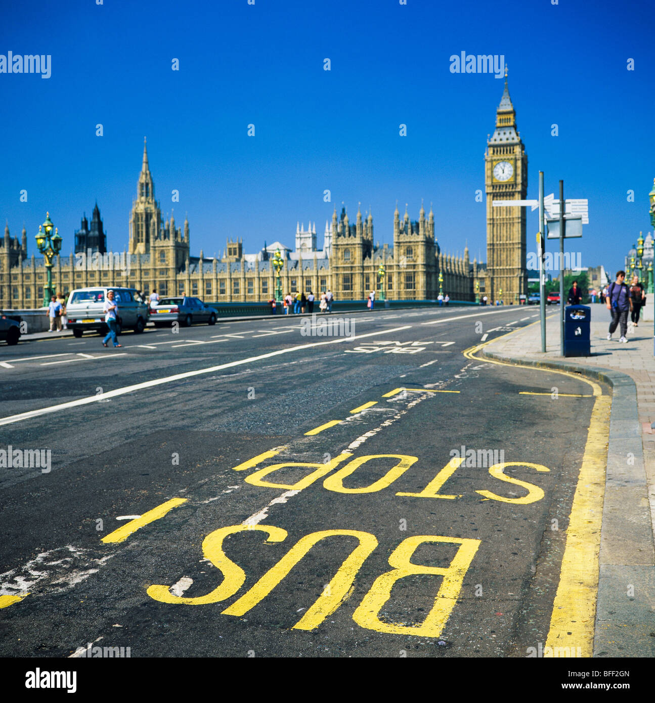 Bus stop sign at Westminster bridge and Westminster Palace with Big Ben ...