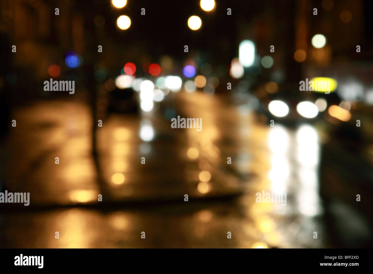 Night time cross town city traffic in the rain Stock Photo - Alamy
