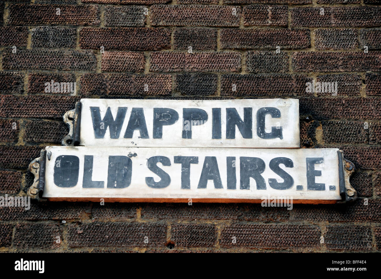 Wapping old Stairs. E. street sign on brick wall East London England UK ...