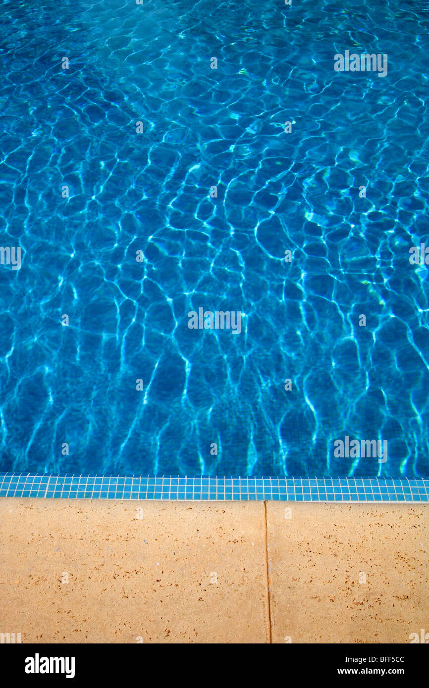 swimming pool blue water detail in summer time Stock Photo - Alamy