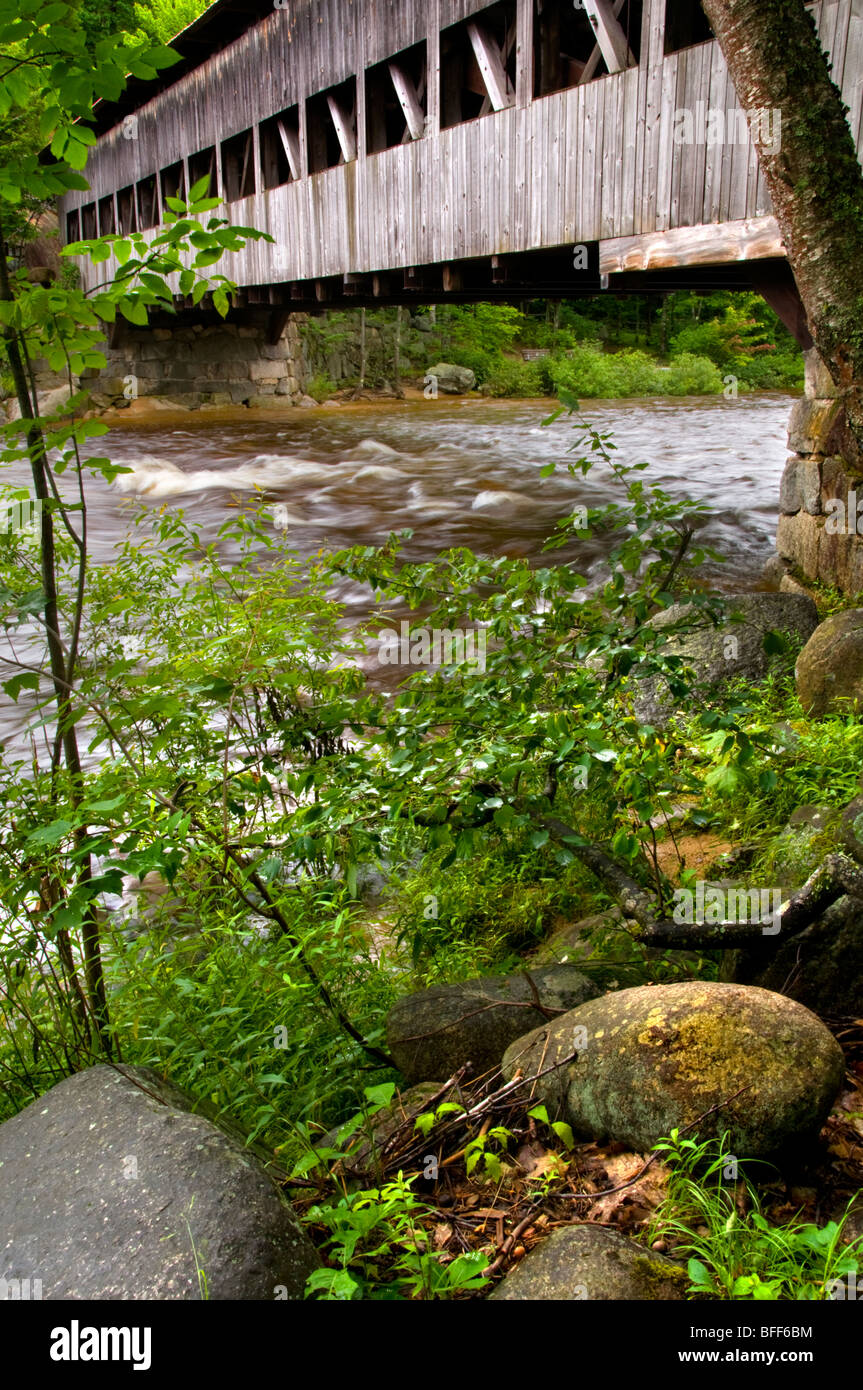 A covered bridge across the Swift River close to the Kancamagus Highway ...