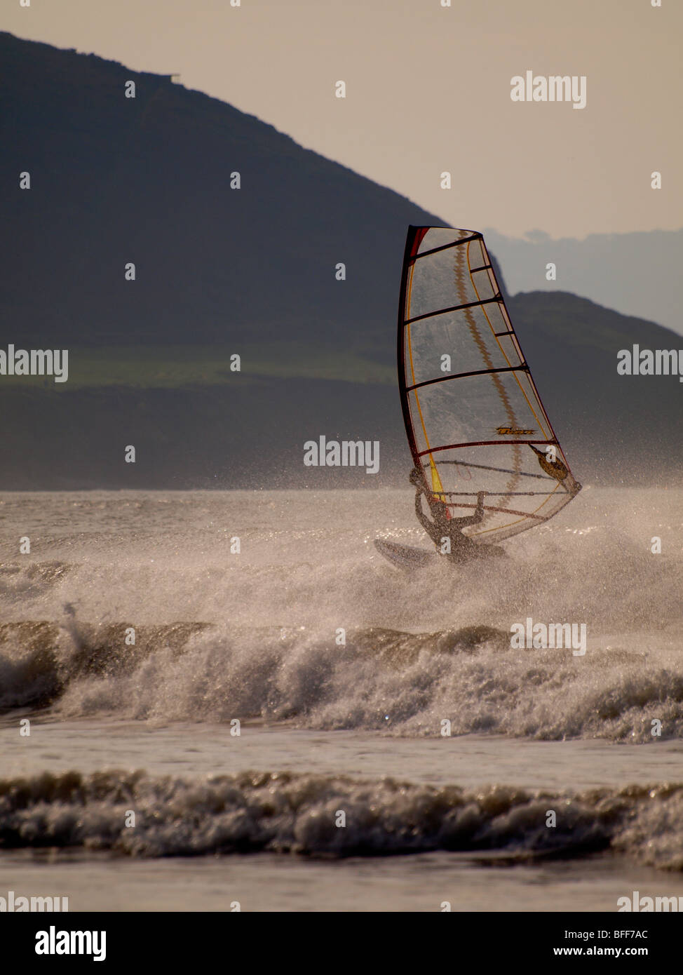 Wind surfer in the spray from the waves Stock Photo - Alamy