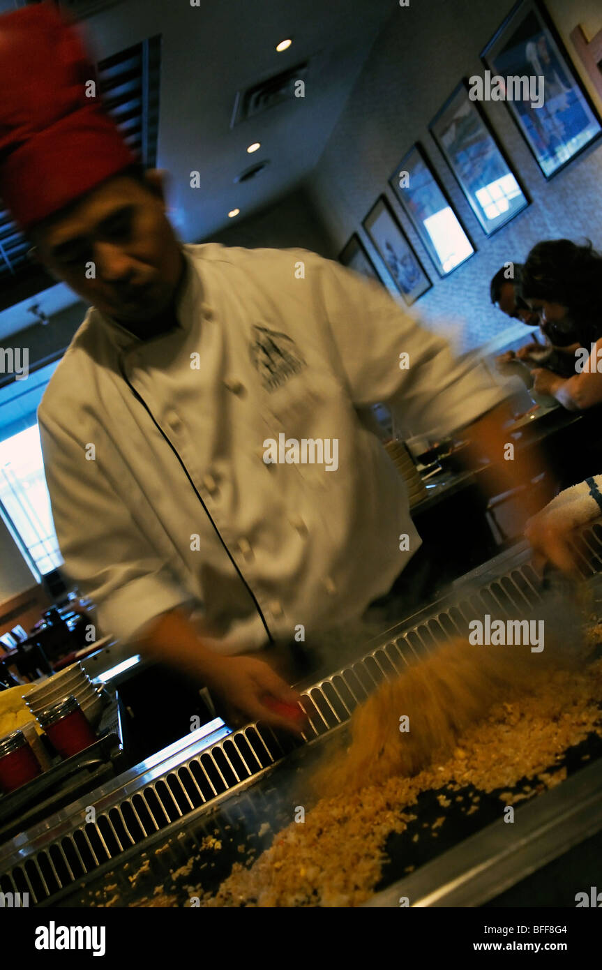 Chef cooking food on a grill at Japanese restaurant Stock Photo - Alamy