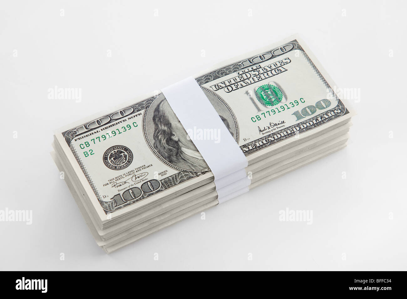 Cutout of a pile of US bank notes on white background Stock Photo - Alamy