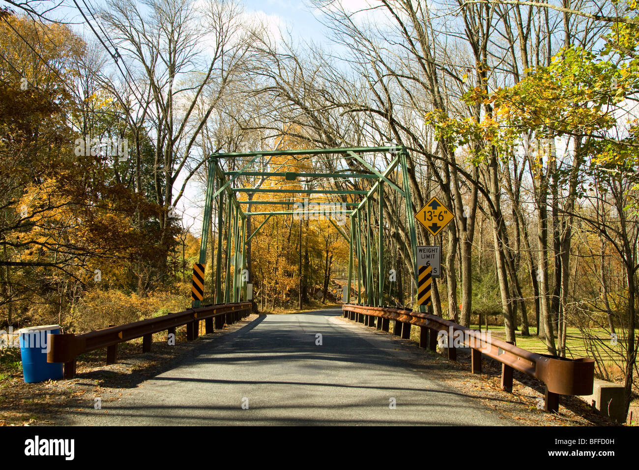 Green steel bridge on country road Stock Photo - Alamy