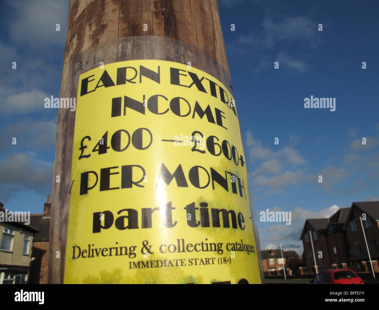 An earn extra income sign at the roadside in a U.K. city Stock Photo ...