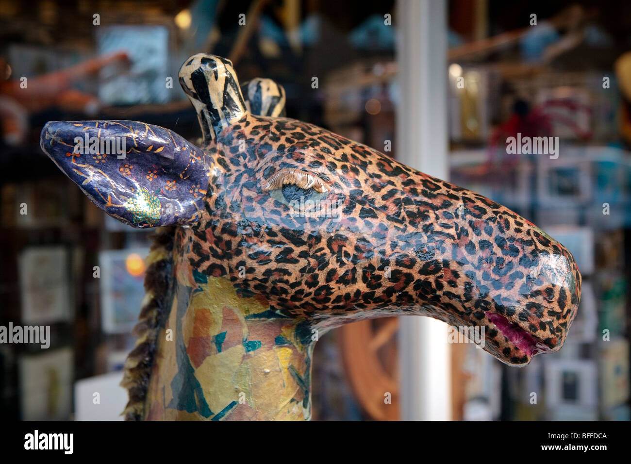 Strange giraffe model outside a shop in Forest Row Stock Photo - Alamy
