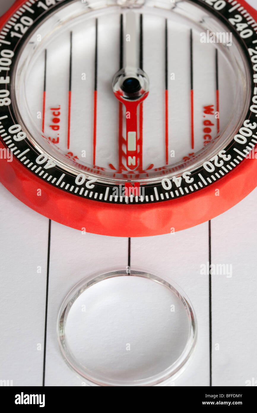 Close-up of an orienteering base plate navigation compass pointing ...