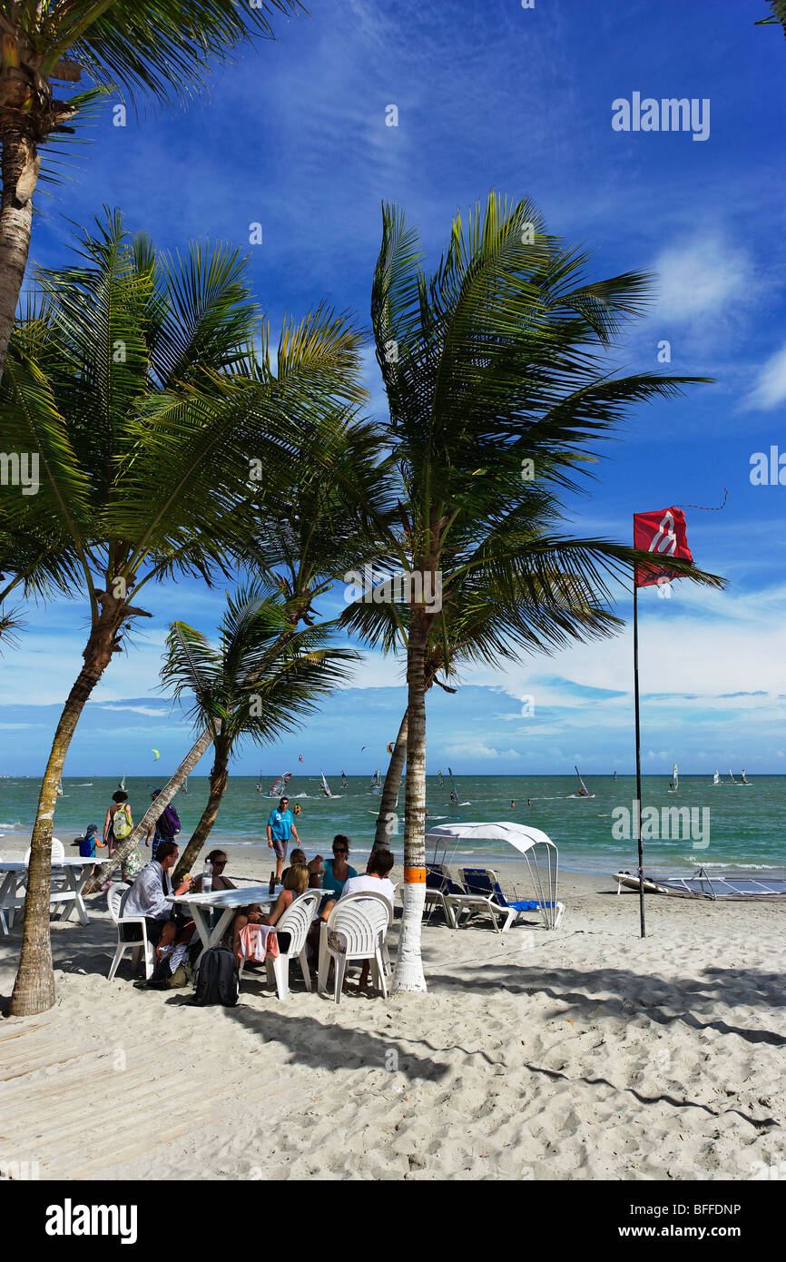 Vacationers at Playa El Yaque, windsurfers in background, Playa El ...