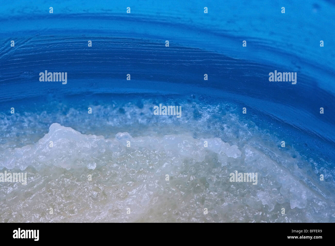 Scrub cream in blue container Stock Photo - Alamy