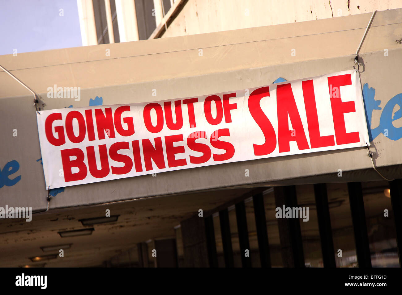 Signs on a building of a company going out of business Stock Photo - Alamy