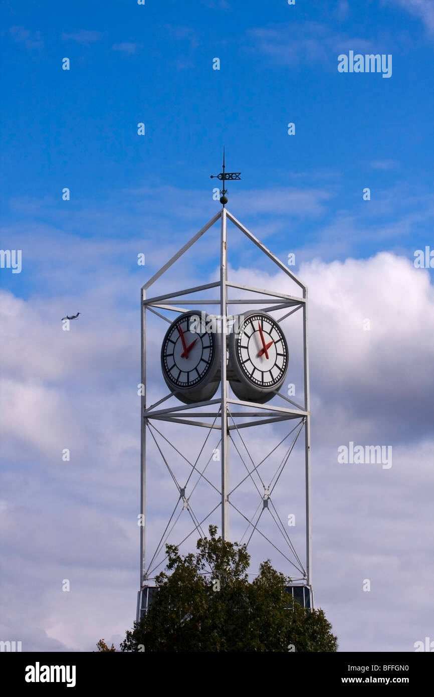 Clock Tower with jet plane in sky Stock Photo - Alamy