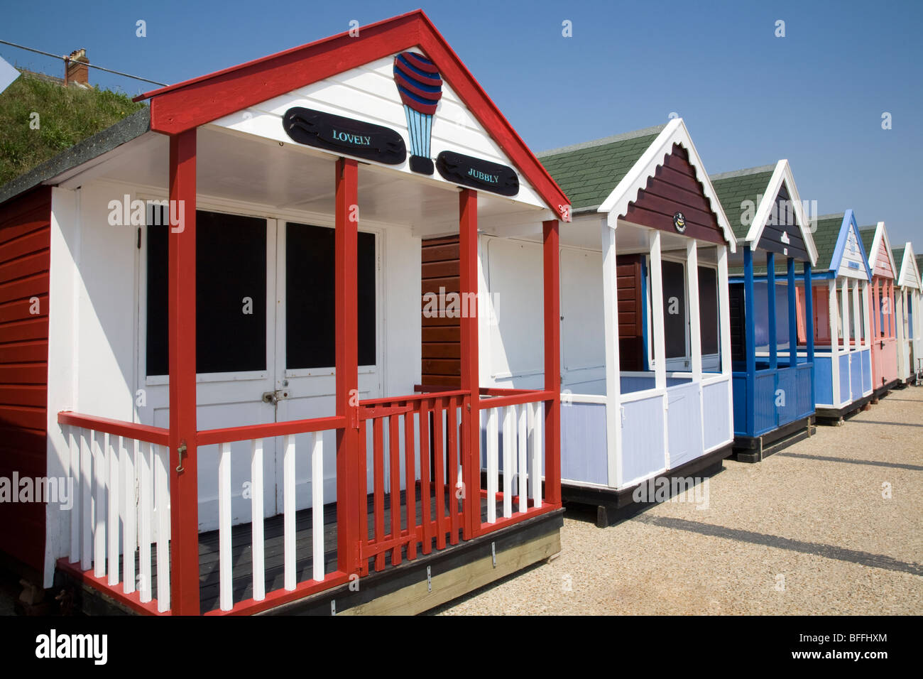 Bright coloured beach huts Stock Photo - Alamy