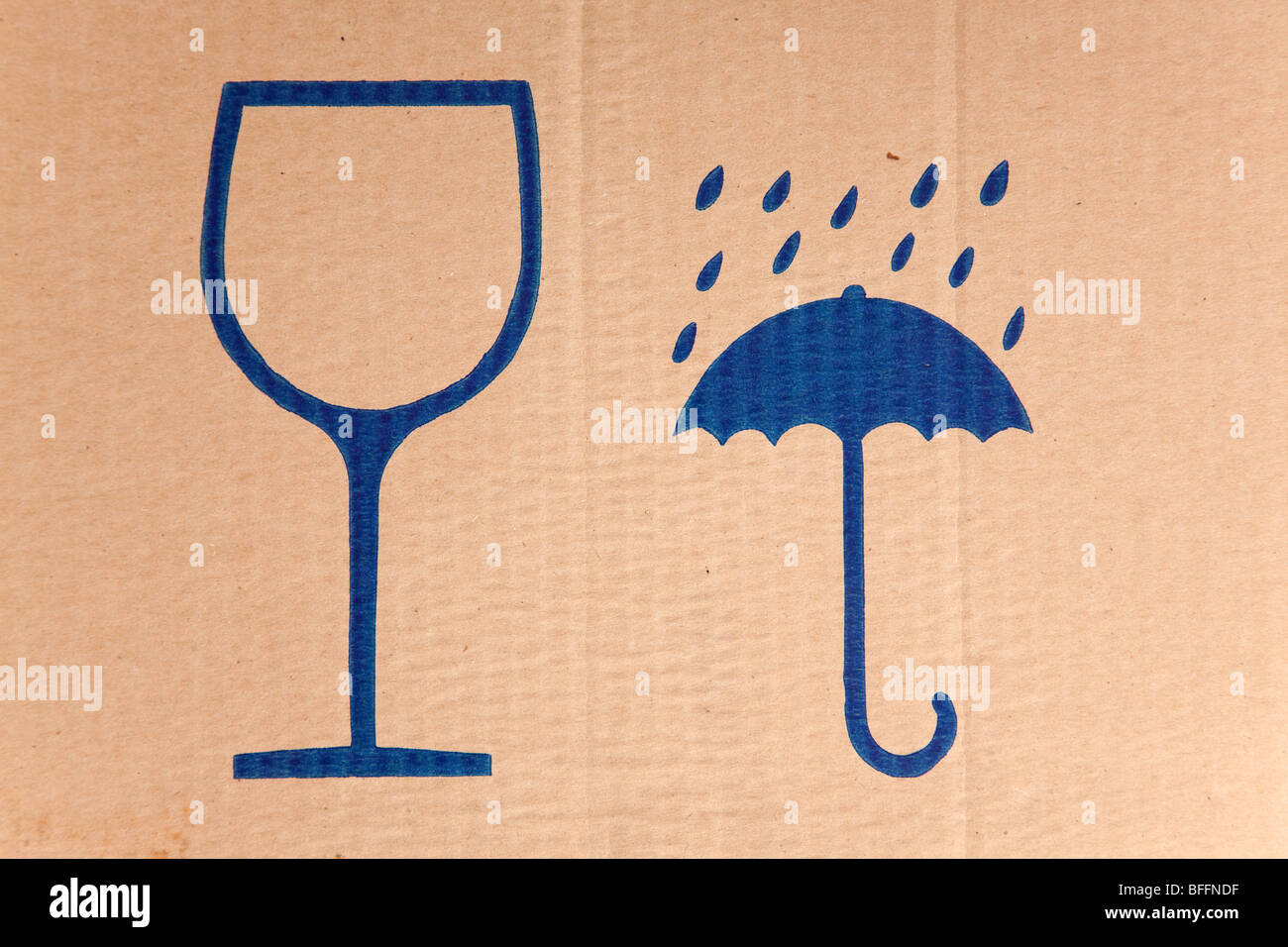 the fragile safety symbols on cardboard Stock Photo - Alamy