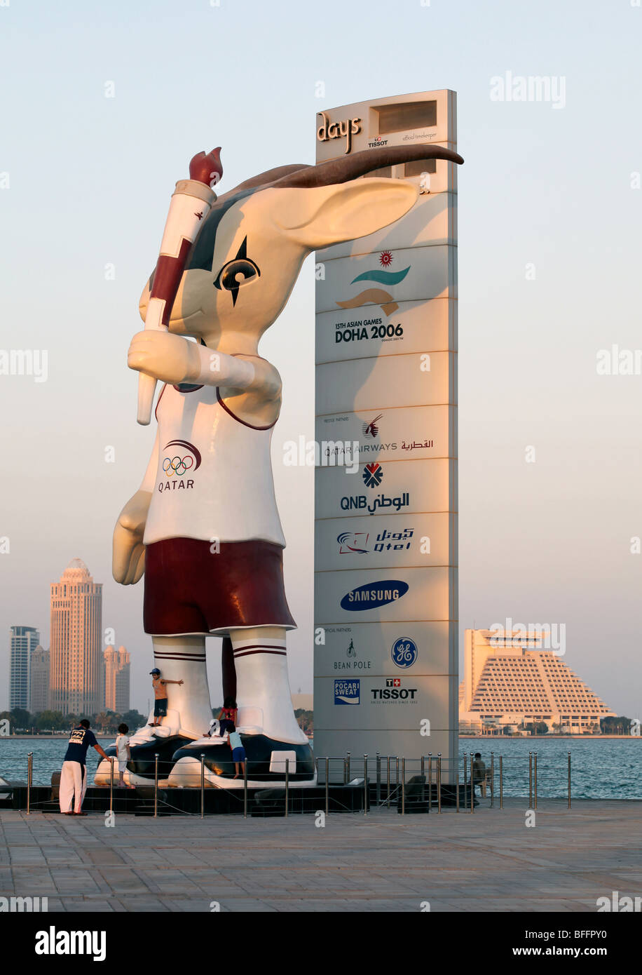 Children play on Qatar's newly redecorated Orry mascot, now in the ...