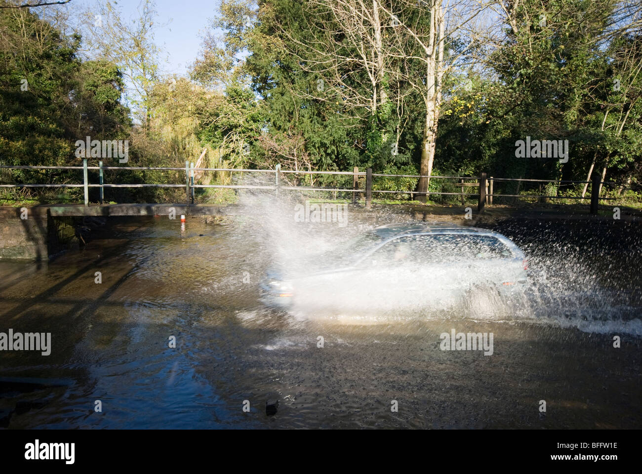 A car driving through a ford at Rufford Lane, near Ollerton ...