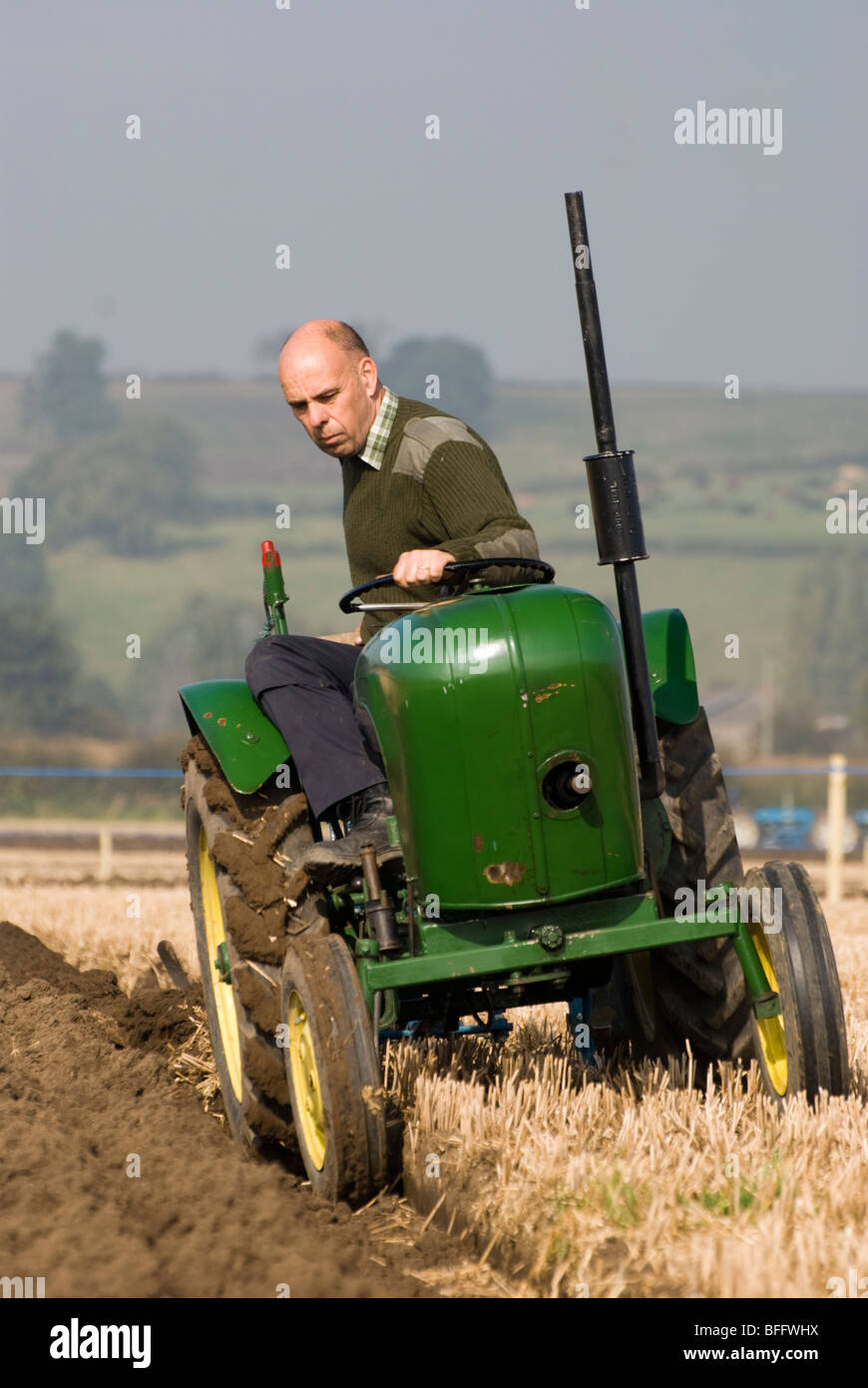 Old fashioned tractor ploughing field hi-res stock photography and ...