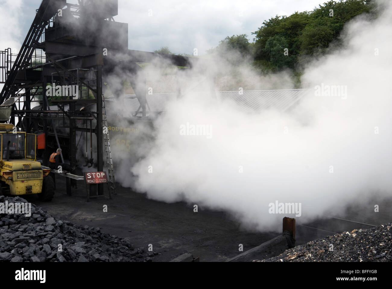 Steam locomotive letting off steam in the refuelling/decommissioning ...