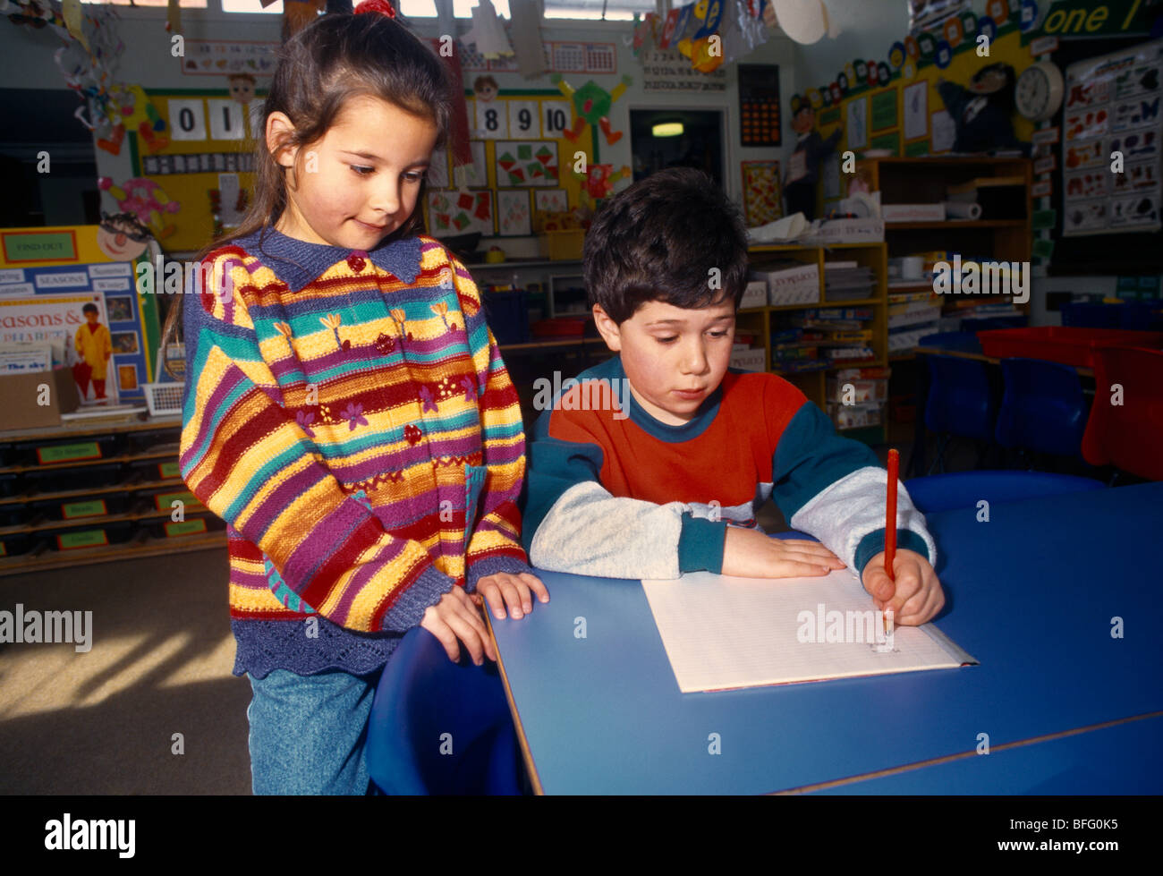 Primary Children Writing Class Stock Photo - Alamy