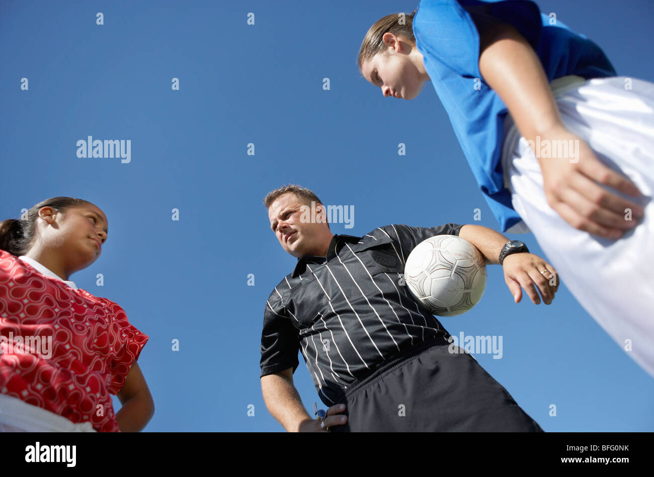 Referee and Soccer Players Stock Photo - Alamy