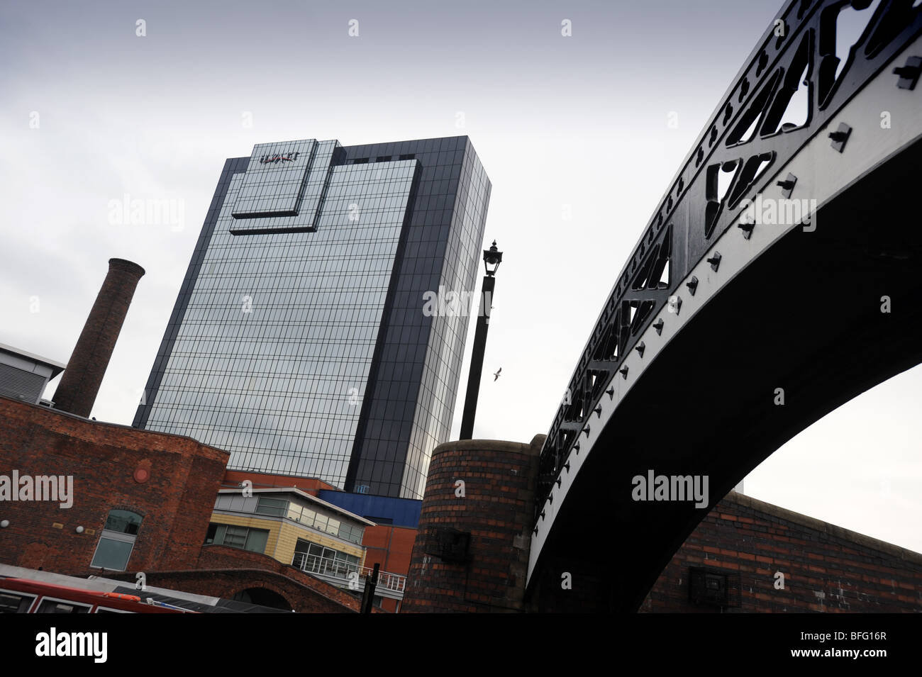 The Hyatt Hotel contrasting with Victorian canal bridge and old chimney ...
