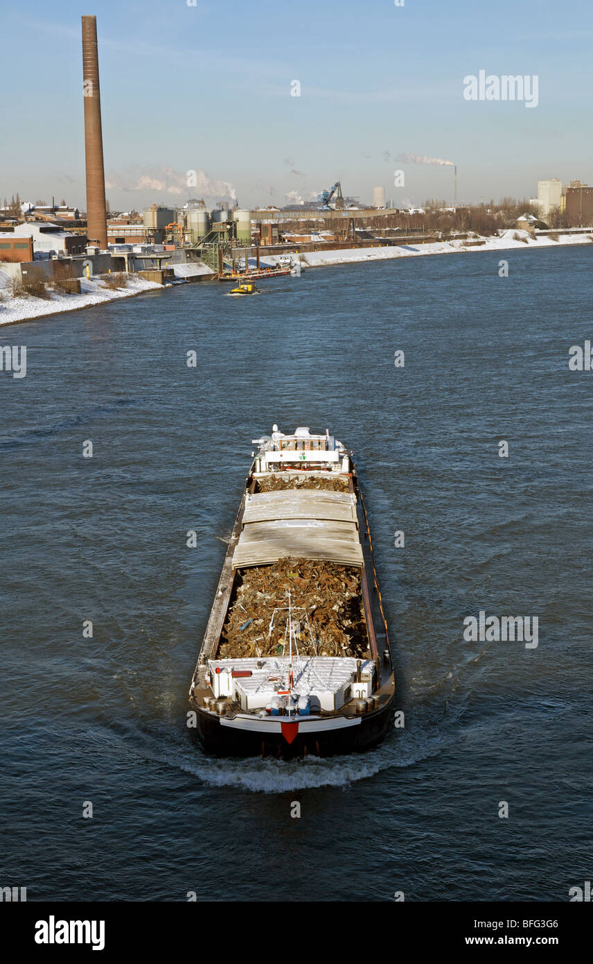 Barge hauling waste metals along the river Rhine, Duisburg, Germany ...