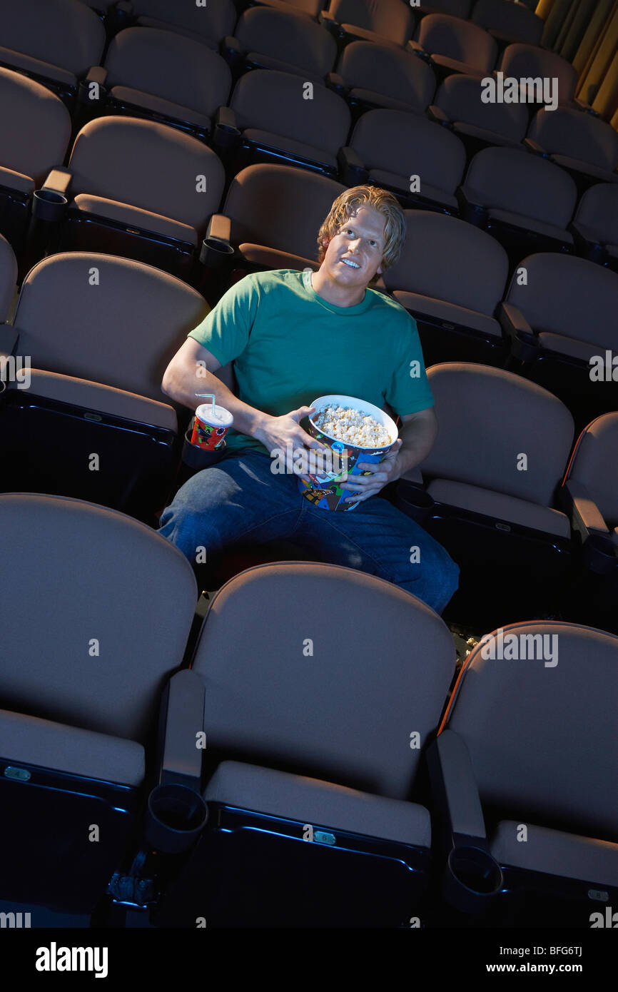 Young Man Watching Movie Stock Photo - Alamy