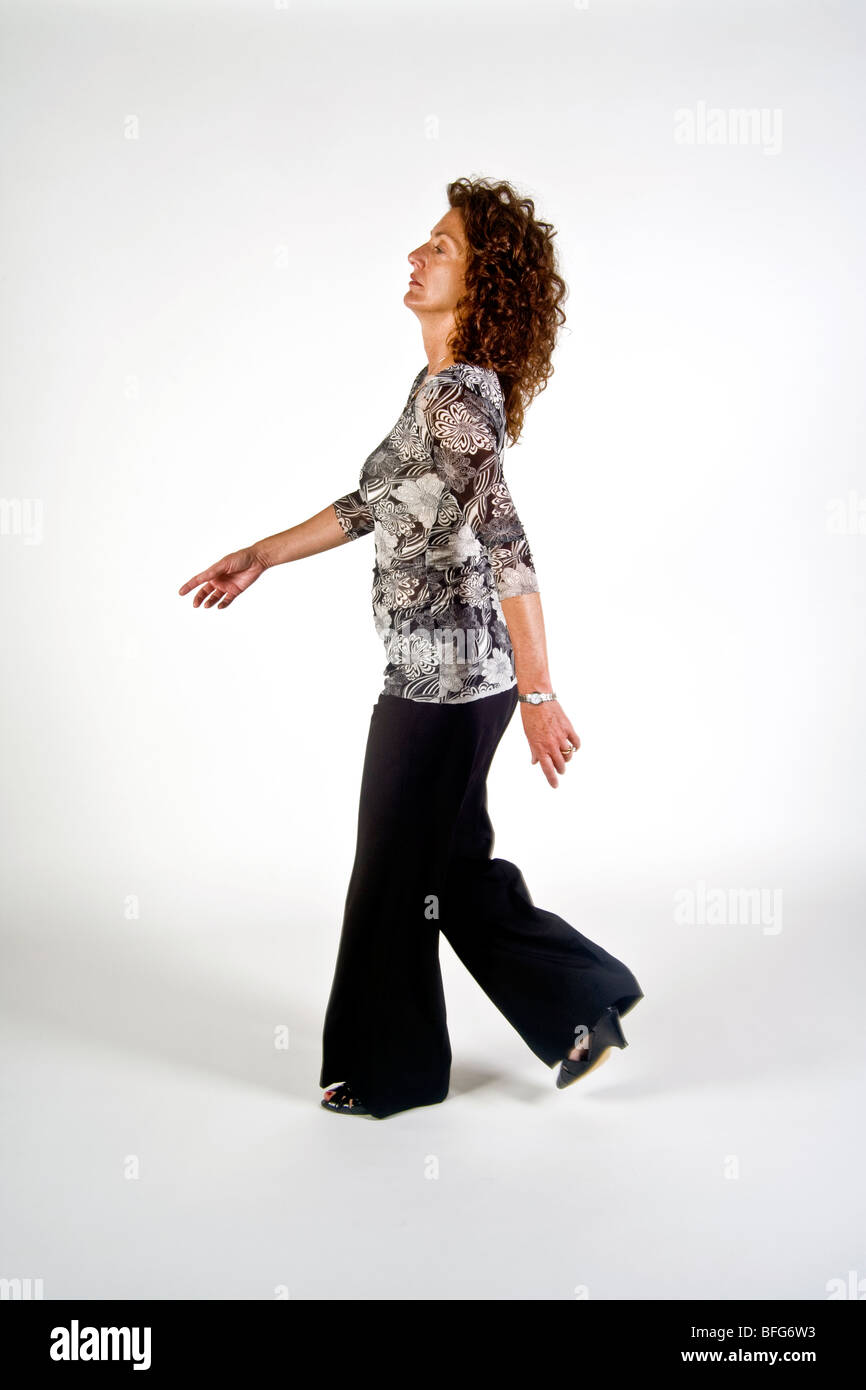 A brisk, erect manner of walking indicates confidence in this woman ...