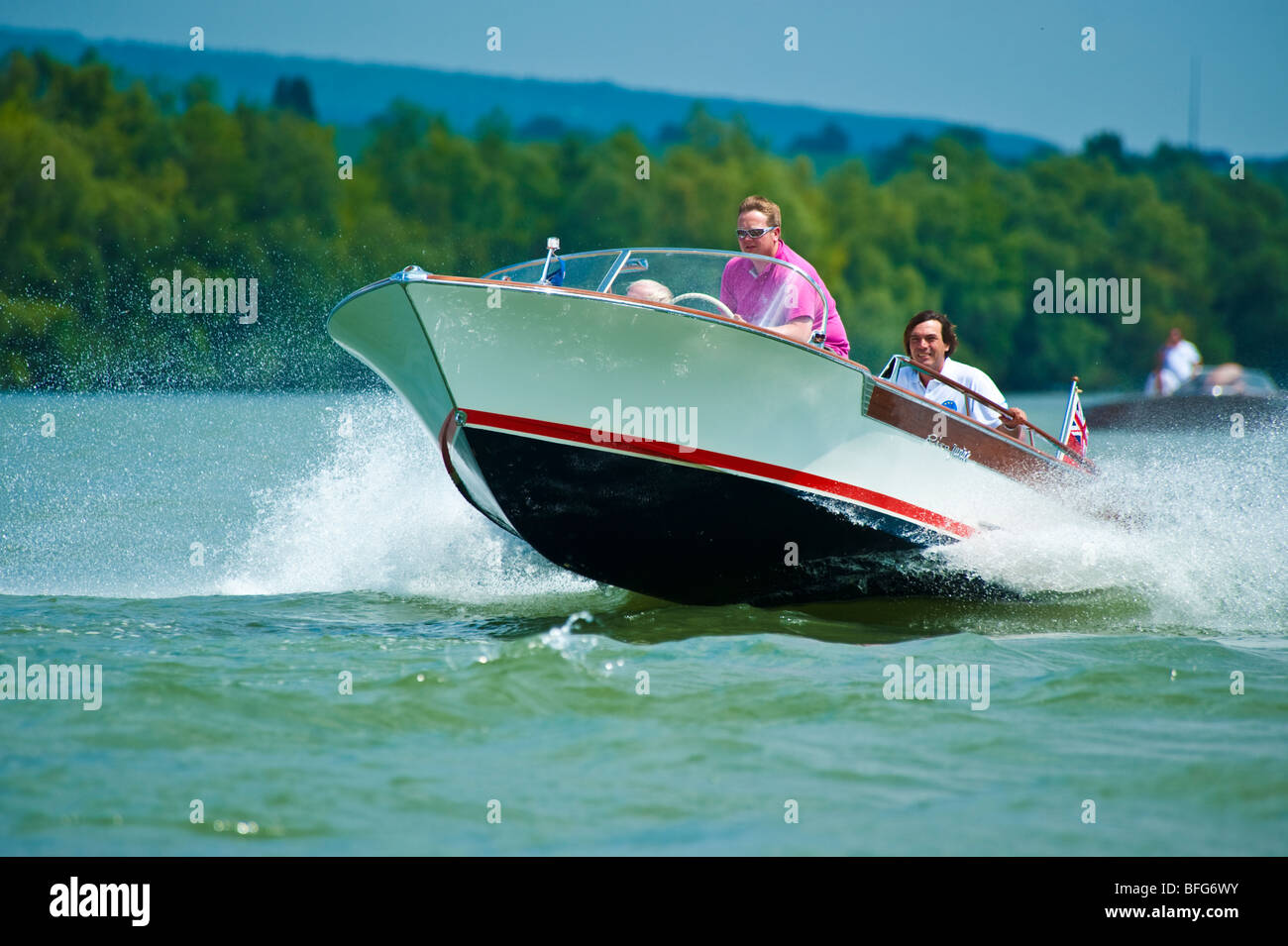 Classical wooden power boat Riva Junior driving with high speed on ...