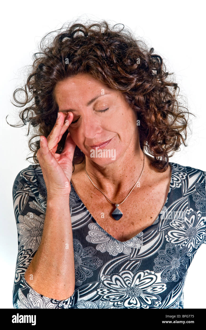 Rubbing her eye indicates a mood of doubt and disbelief in this woman ...