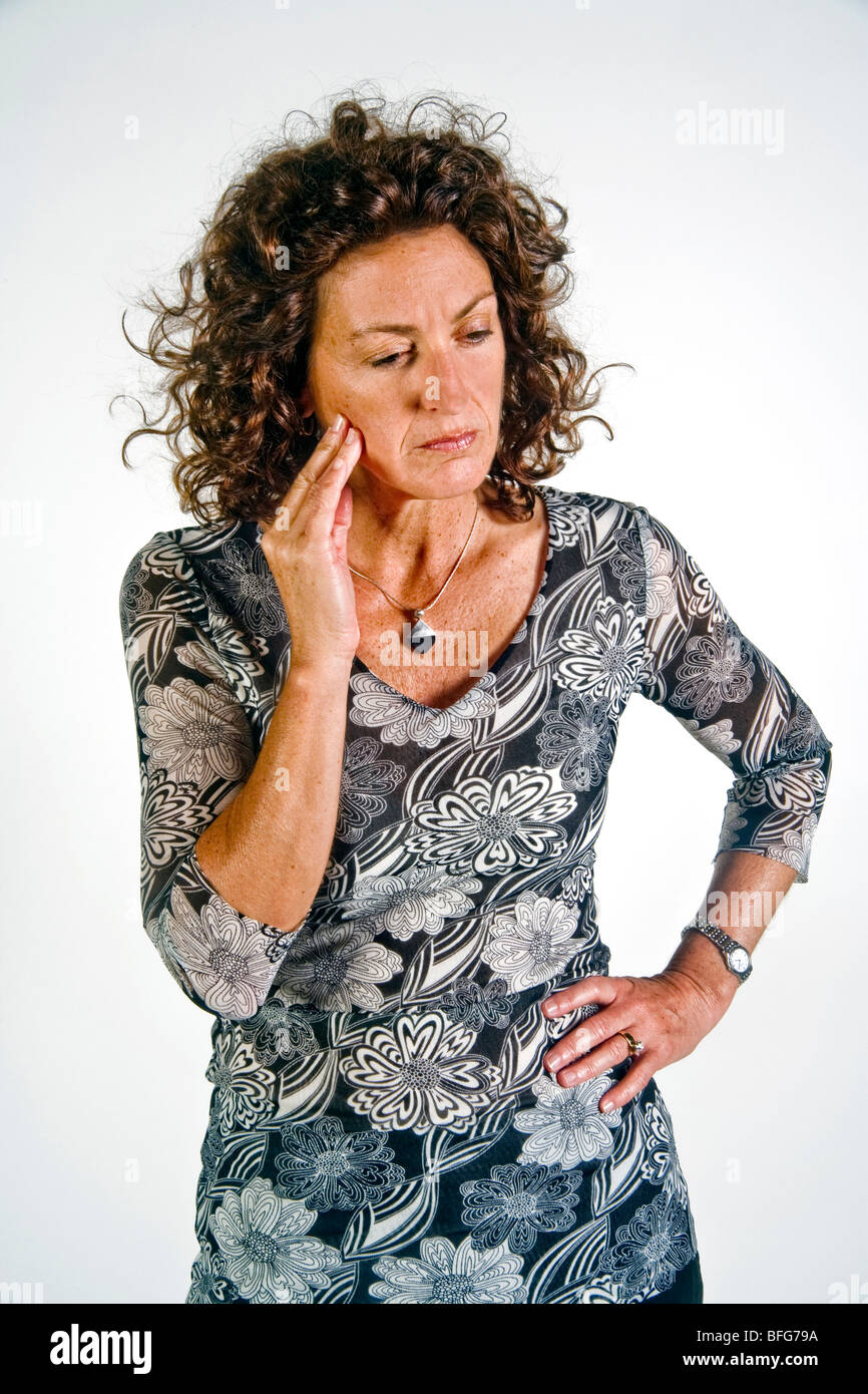 Gesture touch cheek mood thinking hi-res stock photography and images ...