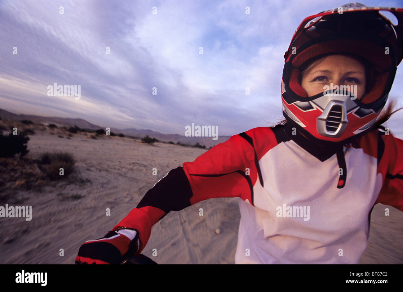 Woman in Racing Gear Riding Motorcycle Stock Photo - Alamy